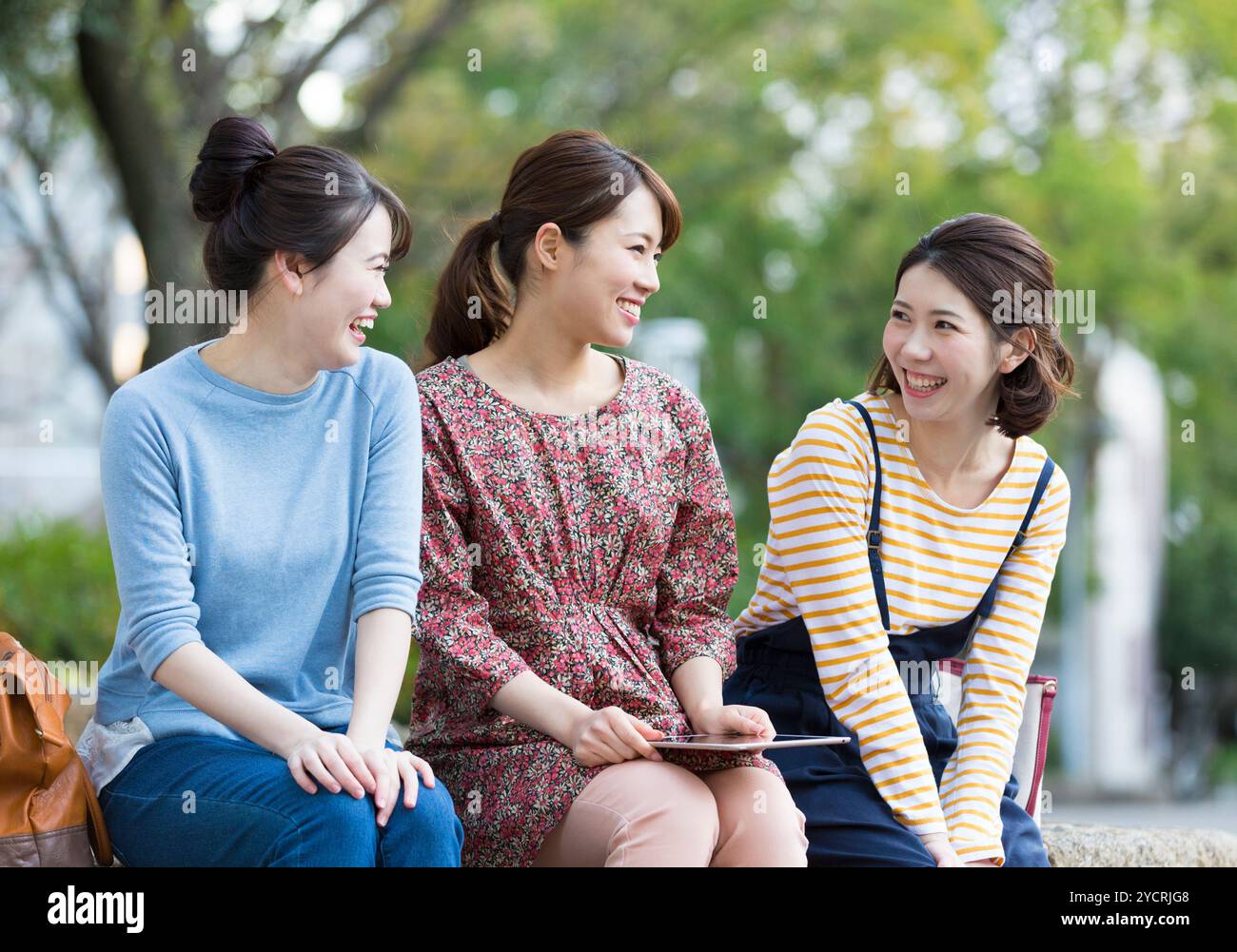 Three college girls Stock Photo - Alamy