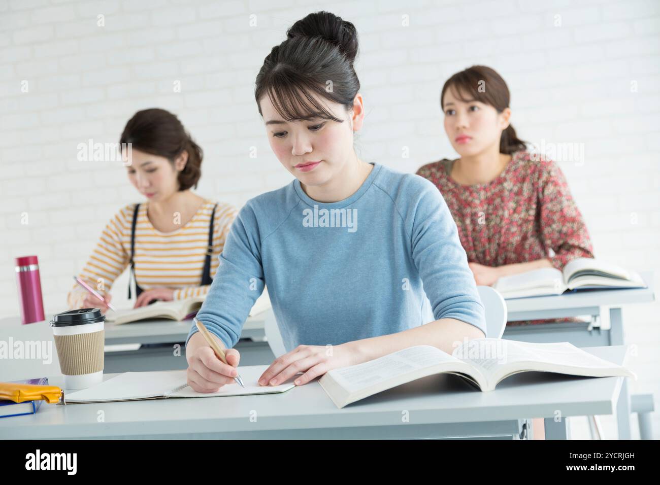 Female university students taking classes Stock Photo - Alamy