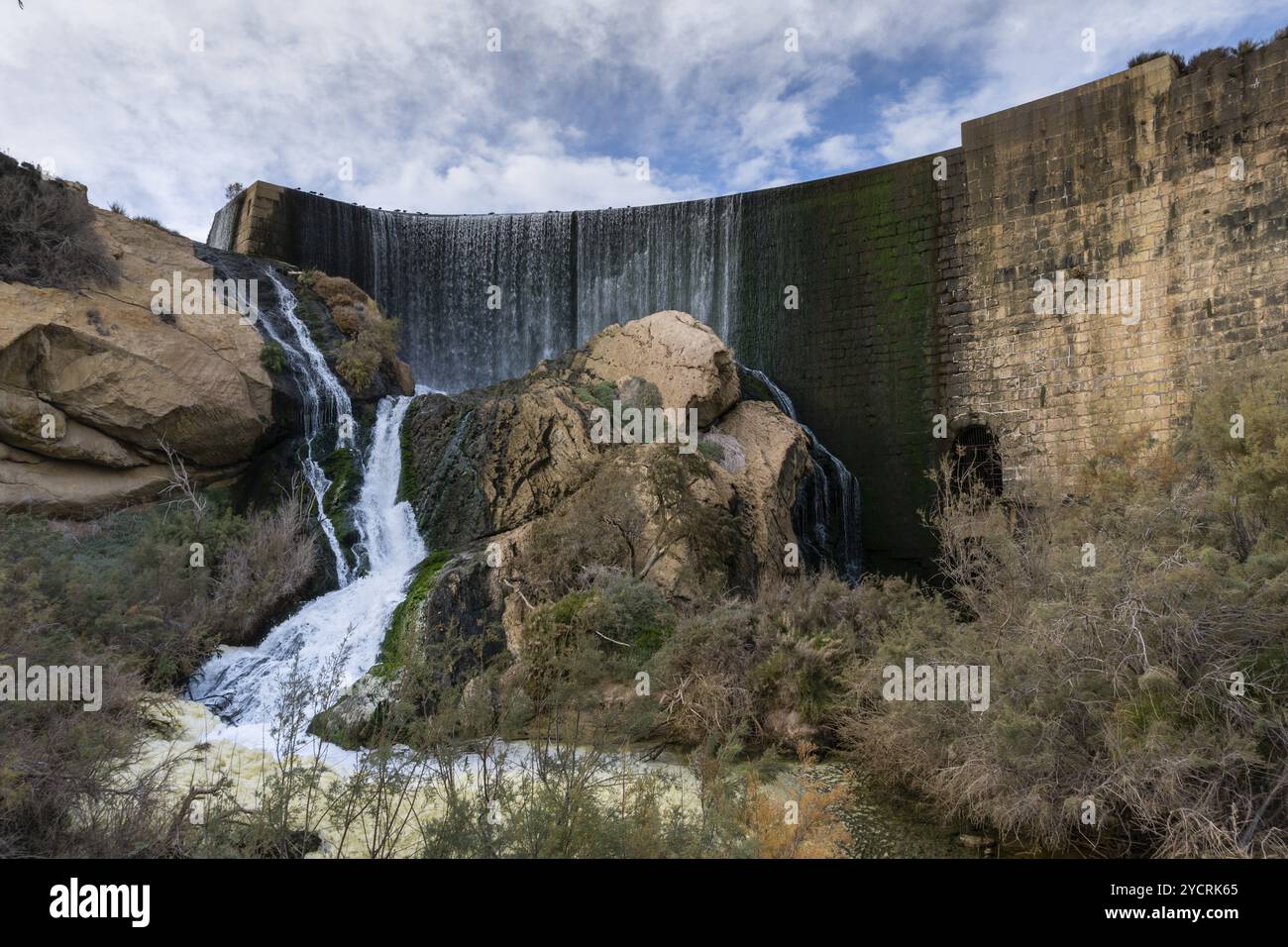 A view of the waterfall and overflow of the dam wall of the Elche ...