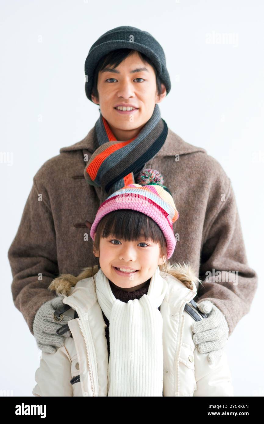 Parent and child wearing winter clothes Stock Photo - Alamy
