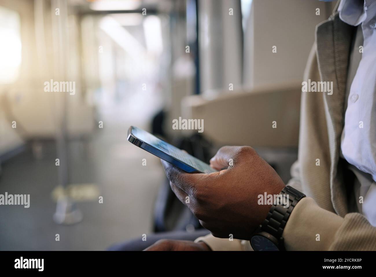 Travel, train and hands of man with phone, typing and checking online ...