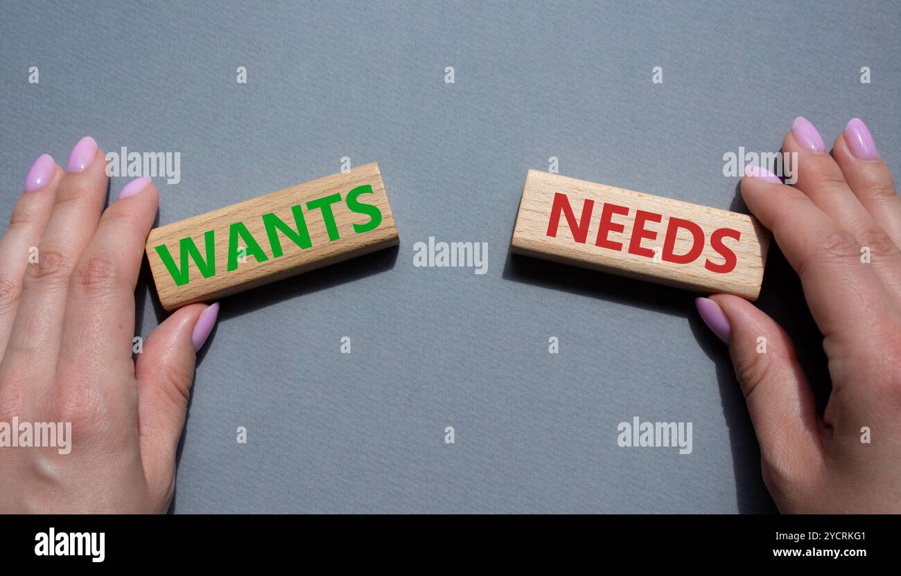 Wants and Needs symbol. Concept word Wants and Needs on wooden blocks ...