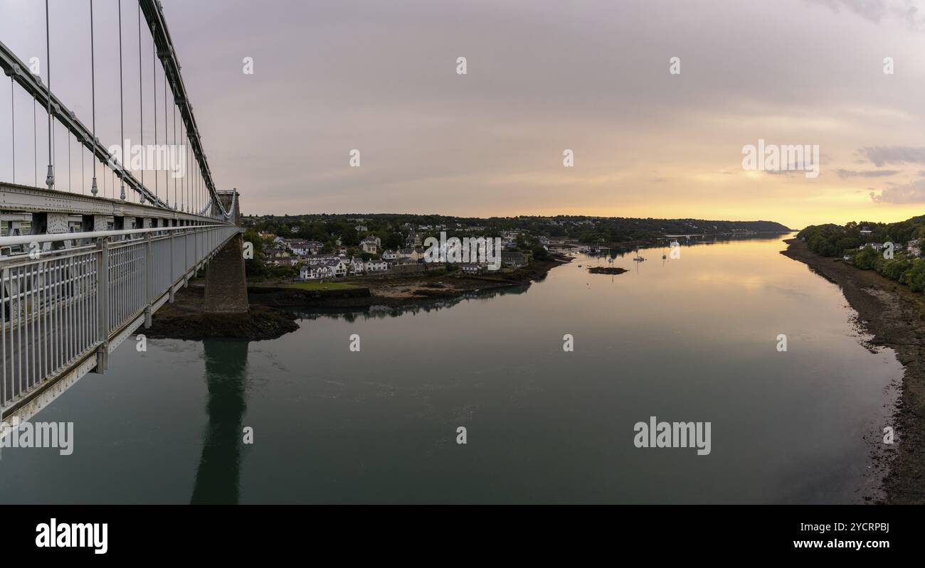 A view of the old Menai Bridge and village with the Menai Strait ...