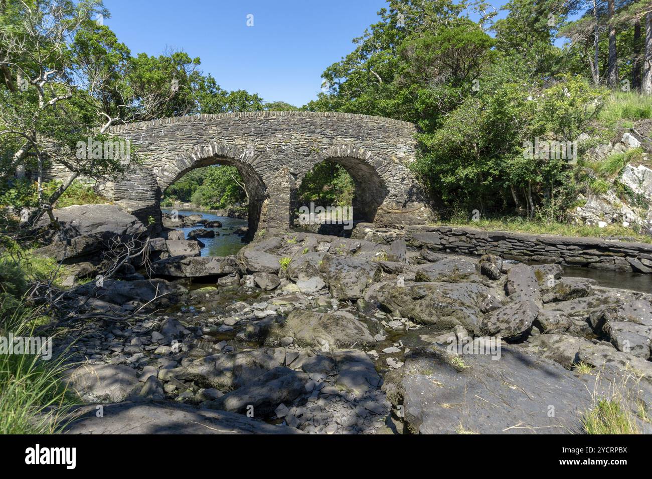 A view of the historic Old Weir Bridge at The Meeting of The Waters in ...