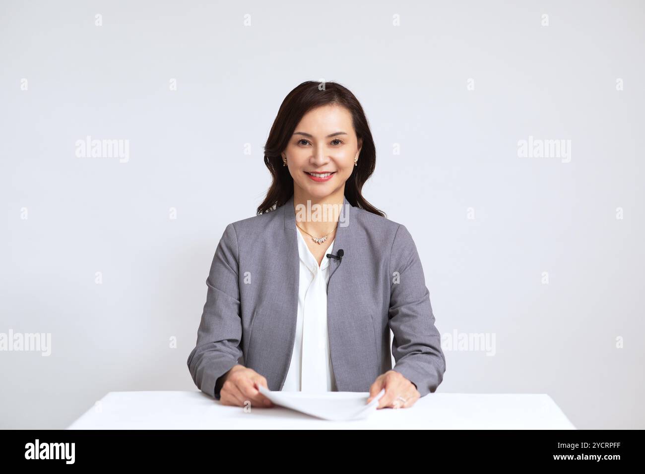 Female news anchor in studio Stock Photo - Alamy