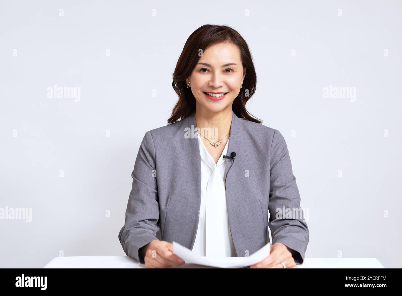 Female news anchor in studio Stock Photo - Alamy
