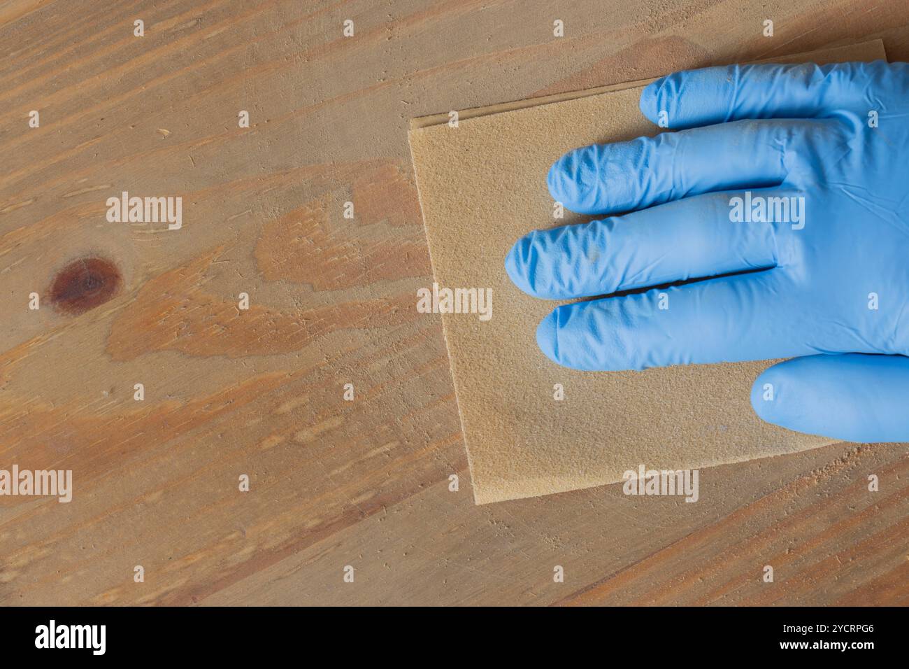 Person sanding wood board using coarse 80 grit grained sandpaper. Do it ...