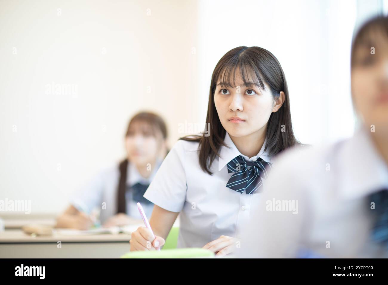 Female school students taking a class Stock Photo - Alamy