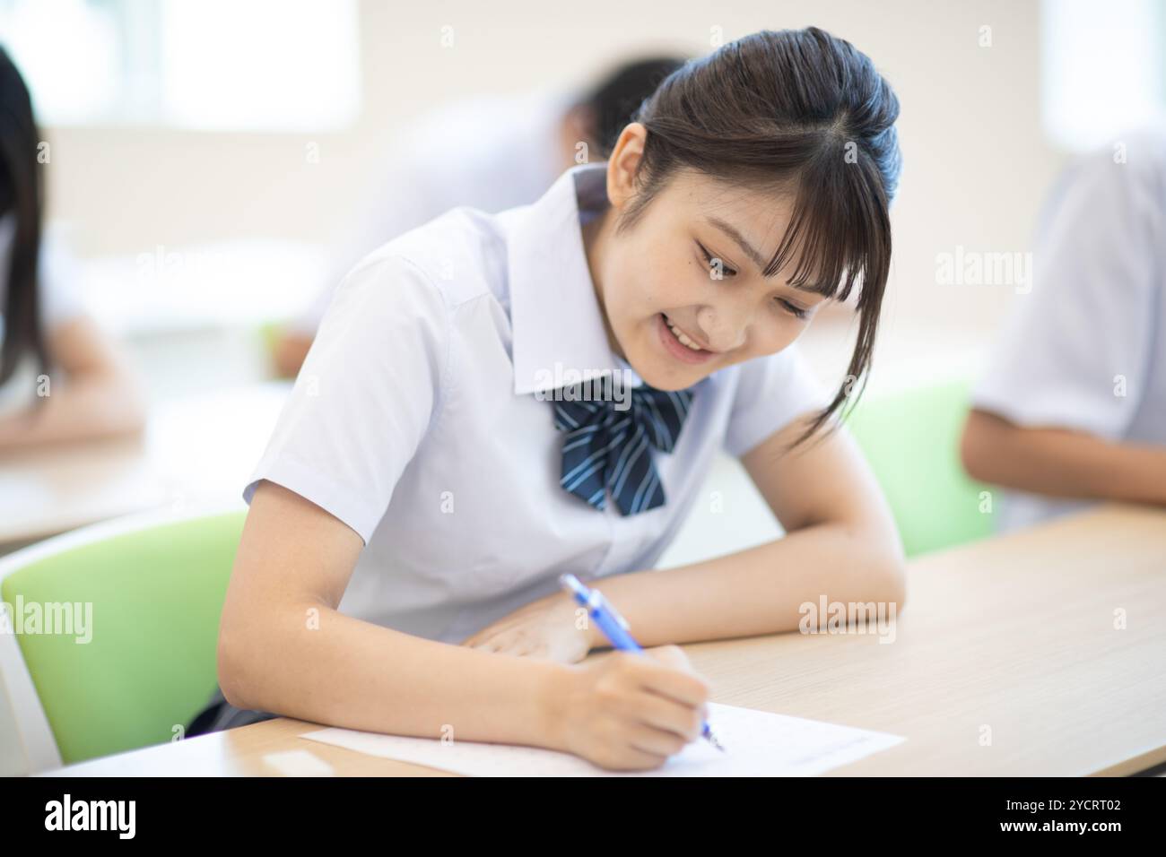 Female school students taking a class Stock Photo - Alamy