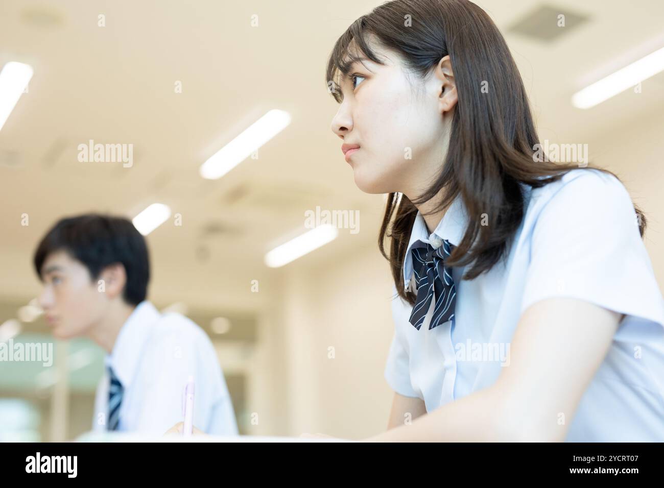 Female school students taking a class Stock Photo - Alamy