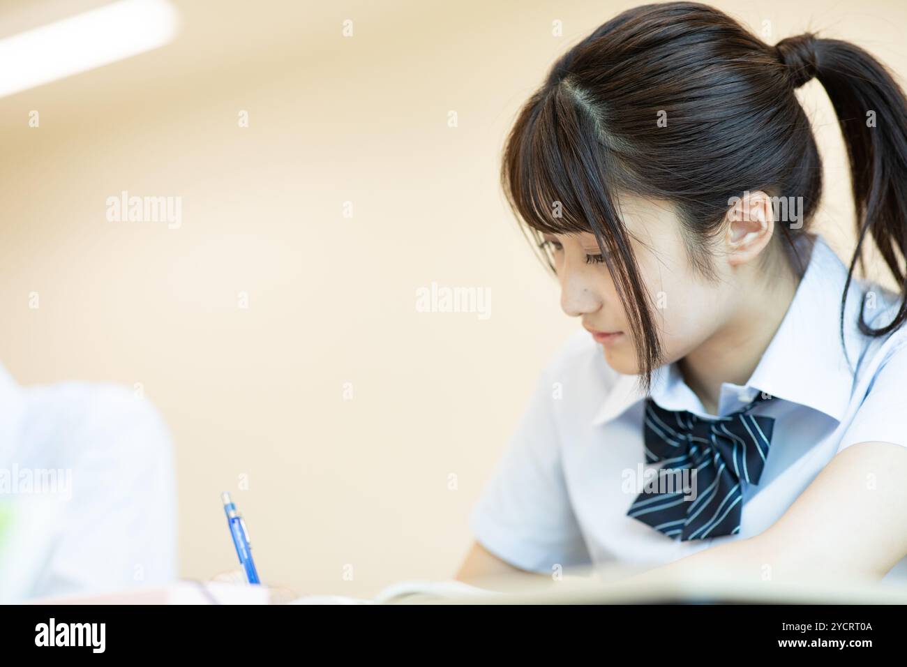 Female school students taking a class Stock Photo - Alamy