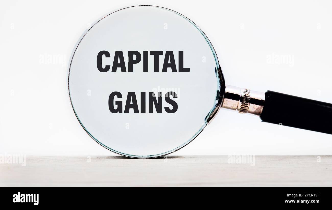 Business and financial concept. Text CAPITAL GAINS on a light gray ...