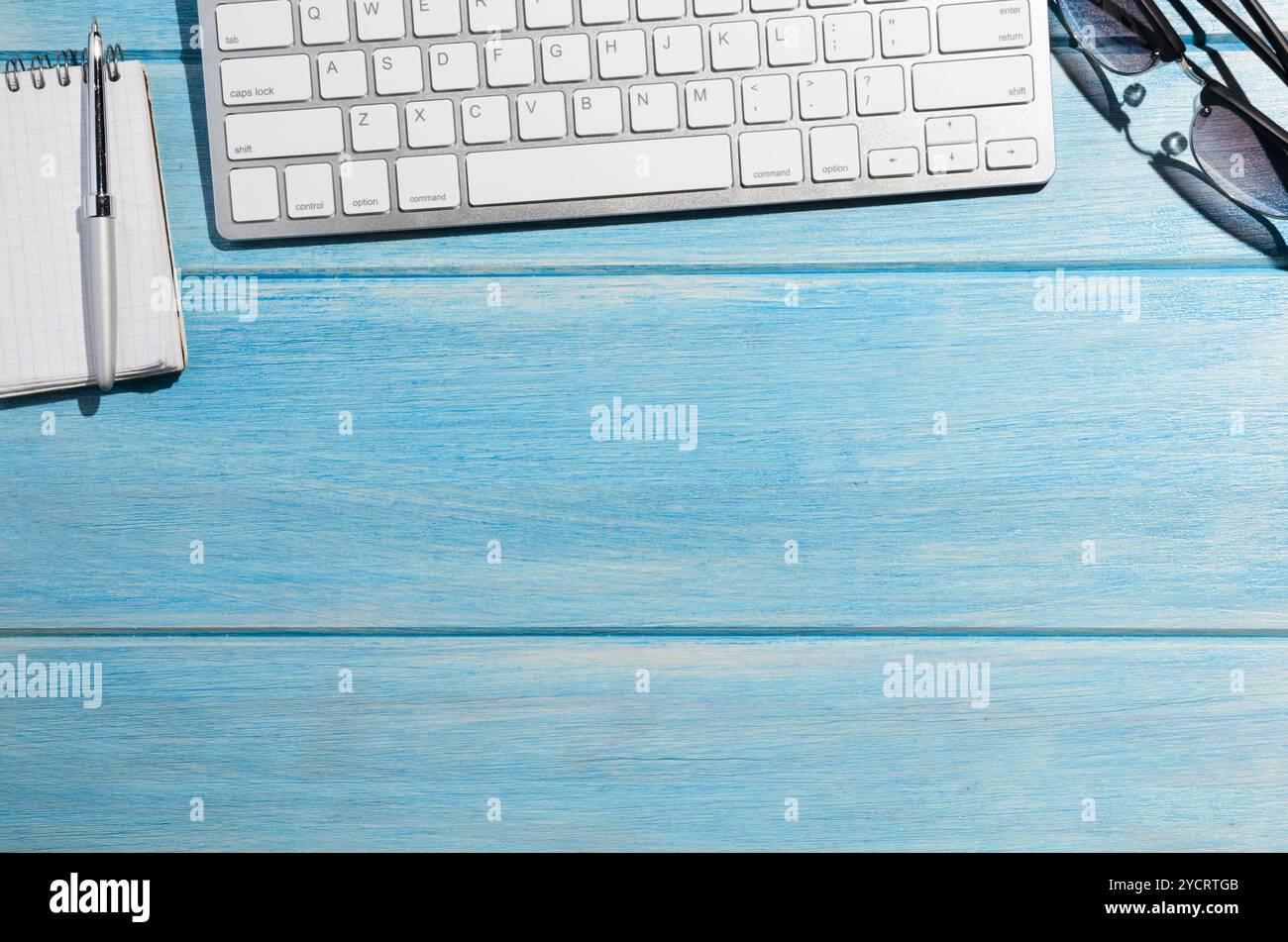 Keyboard on table Stock Photo - Alamy