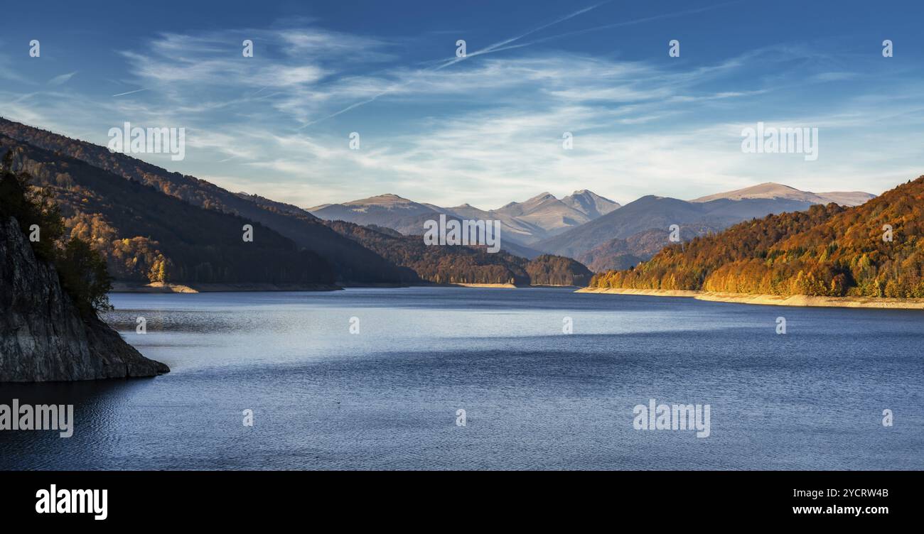Autumn panorama landscape of Lake Vidraru and the Fagaras Mountains in ...