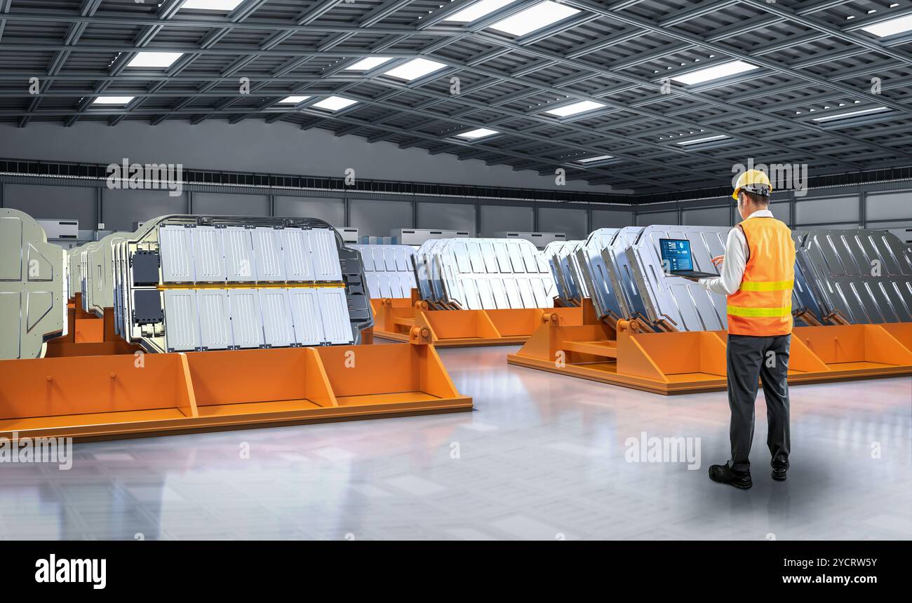 Asian engineer work with batch of electric vehicle batteries or pallet ...