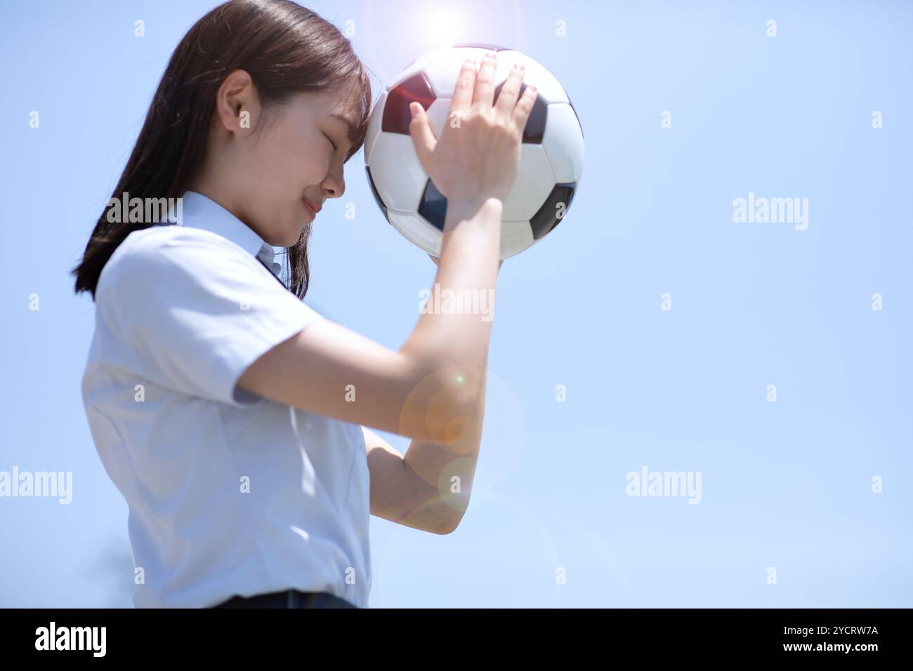 High school student with football Stock Photo - Alamy