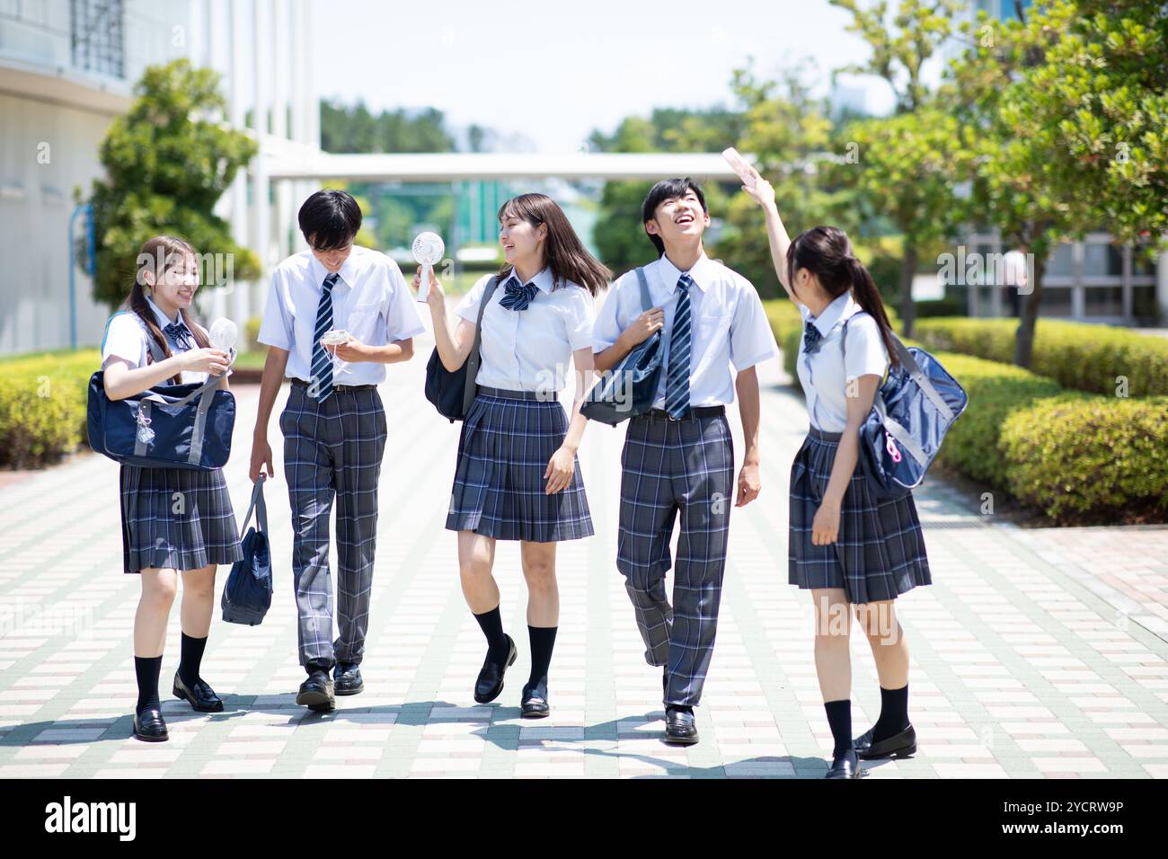 High school students leaving school Stock Photo - Alamy