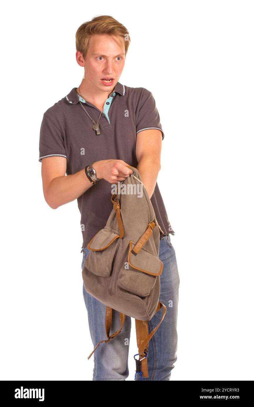 Young shocked student opening his backpack. Isolated on white ...