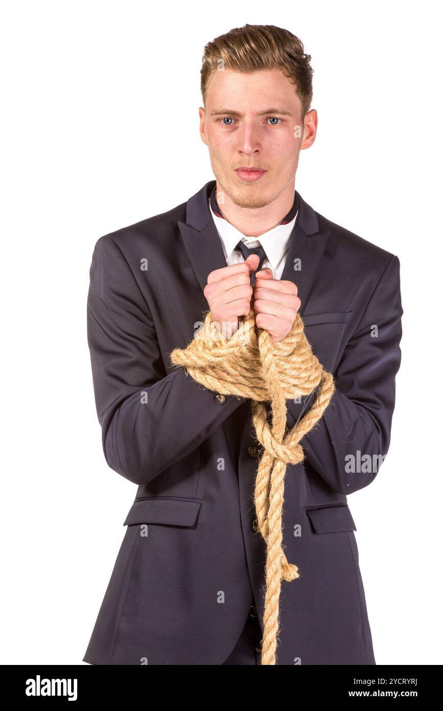 Businessman tied up in rope Stock Photo - Alamy