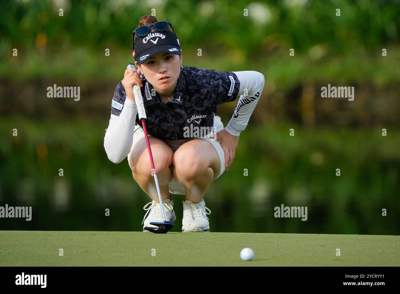 Yuna Nishimura of Japan lines up a putt on the 2nd green during the ...