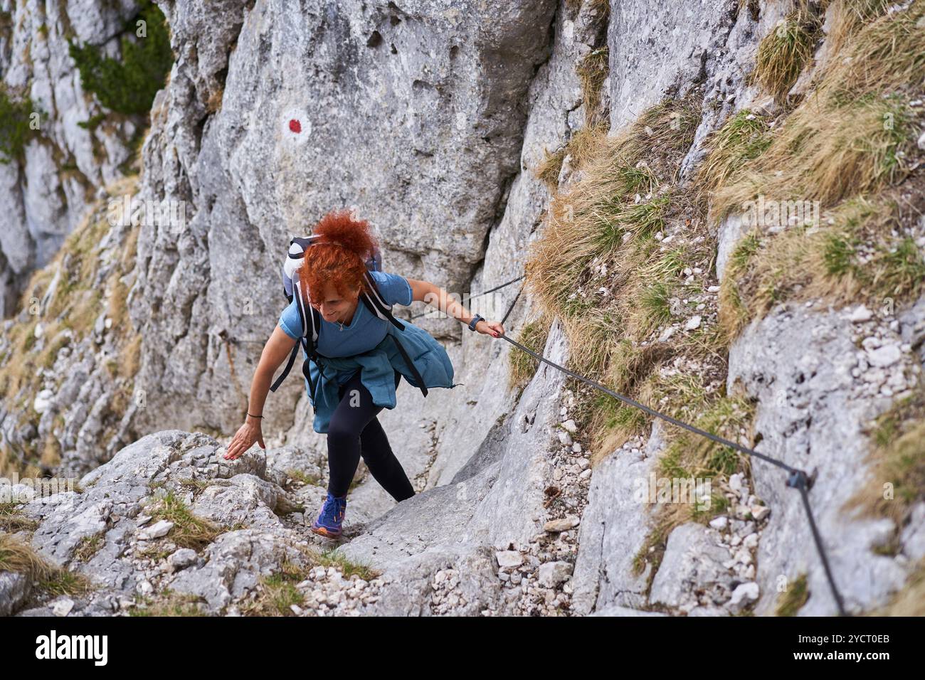 Woman climbing on a steep hiking trail with via ferrata Stock Photo - Alamy