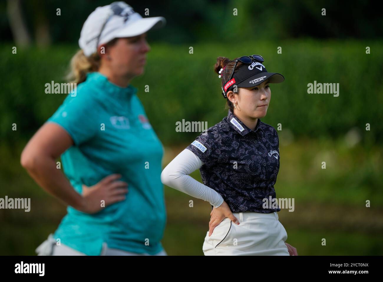 Yuna Nishimura of Japan, right, stands on the 2nd green during the ...