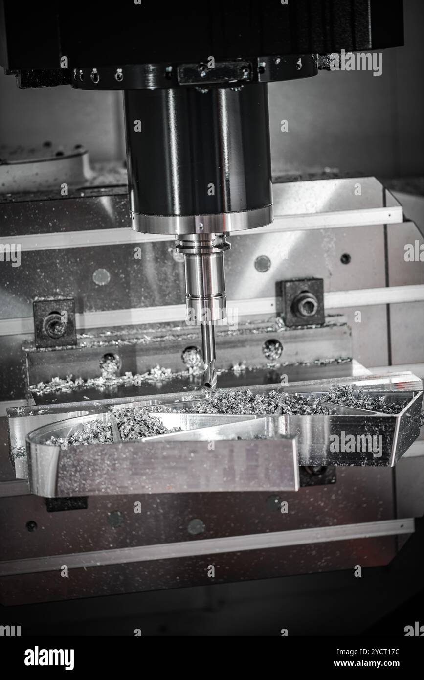 Metalworking CNC milling machine. Cutting metal modern processing technology. Small depth of ...