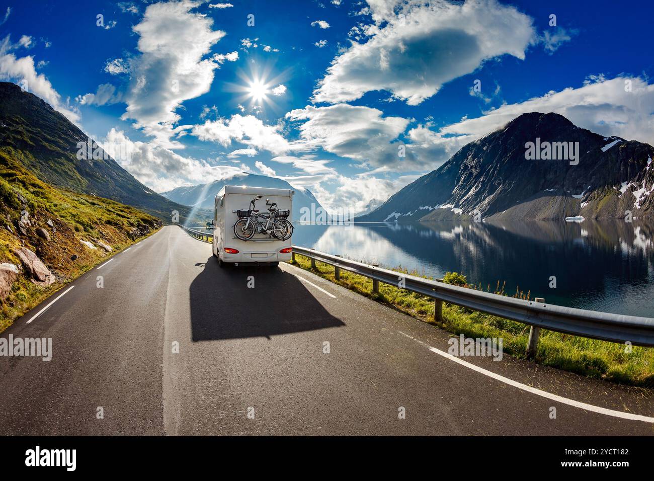 Caravan car travels on the highway Stock Photo - Alamy