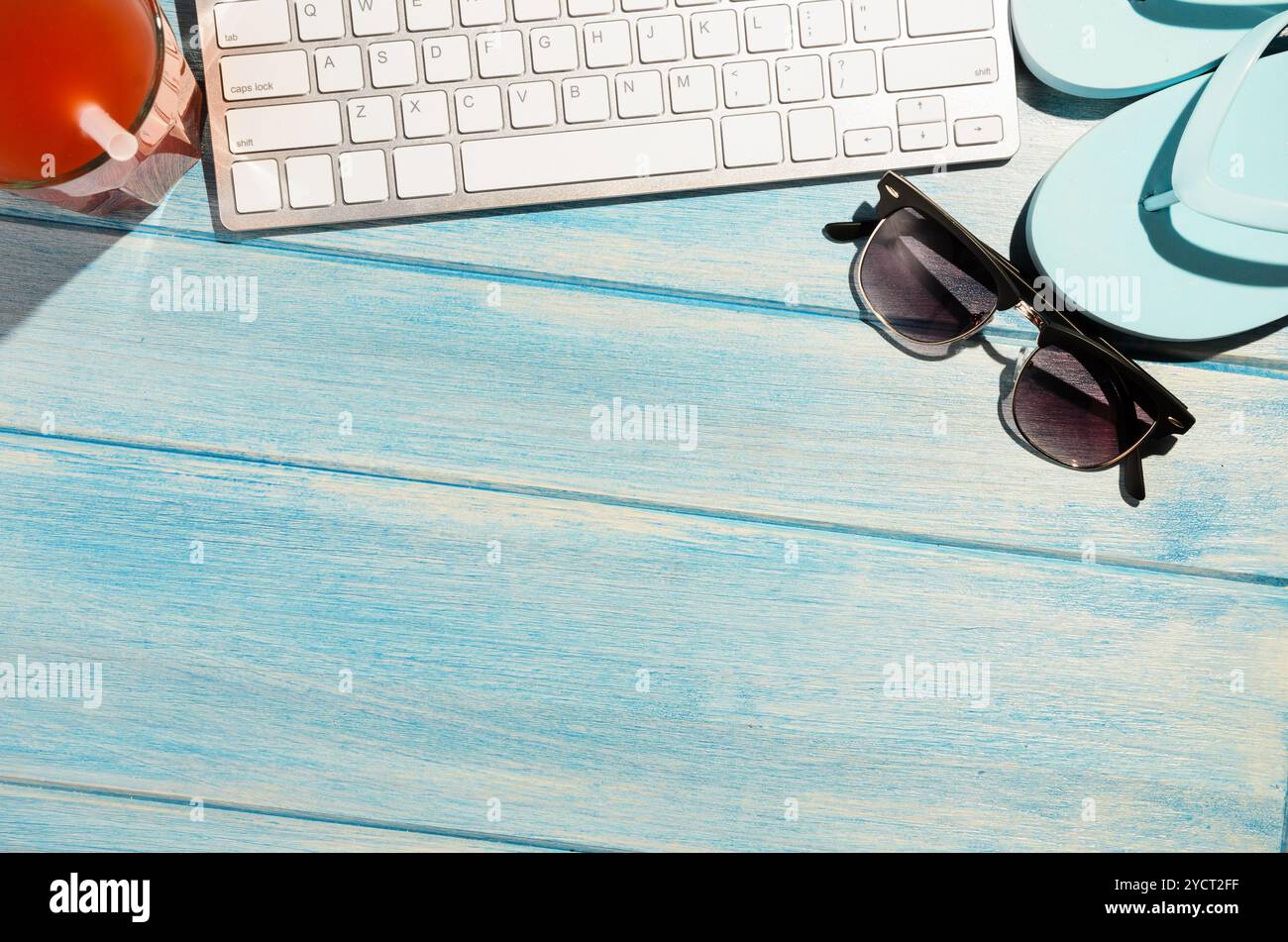 Keyboard on beach table Stock Photo - Alamy
