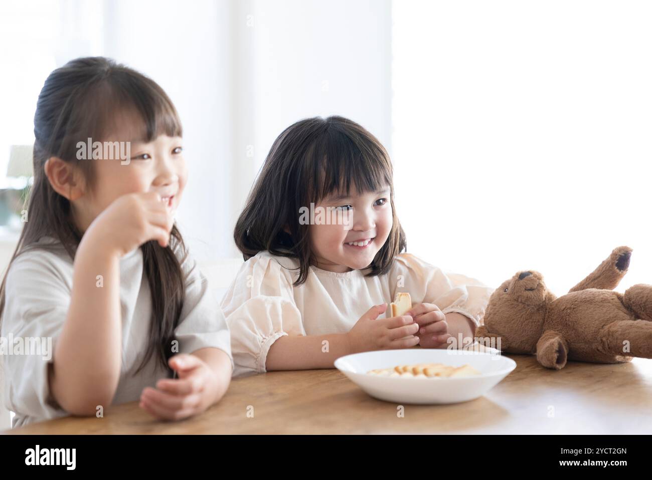 Girl eating a snack Stock Photo - Alamy