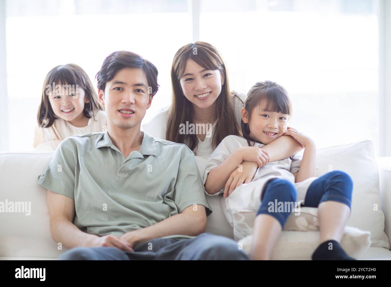 Sisters eating a snack Stock Photo - Alamy
