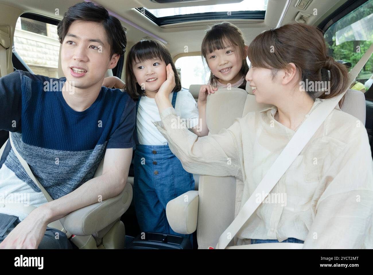 Family in car Stock Photo - Alamy