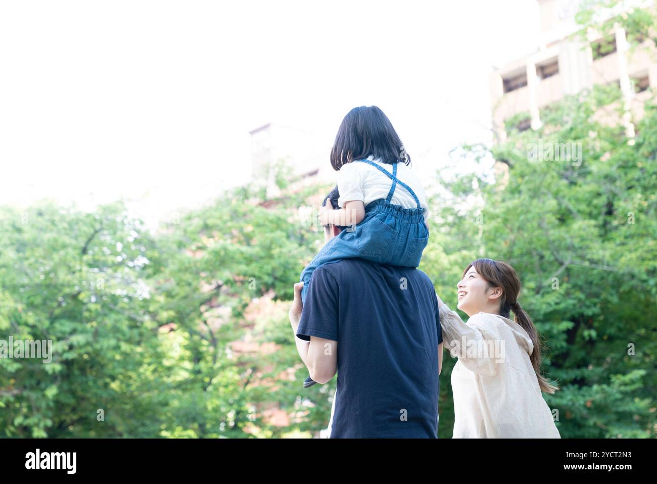 Back view family three hi-res stock photography and images - Alamy