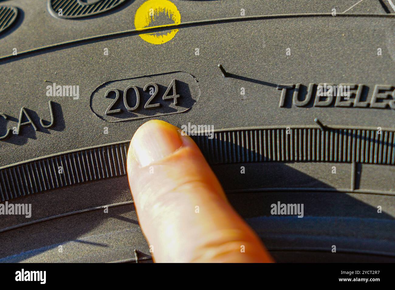 Side view of tire with designation that specify of week and year of ...