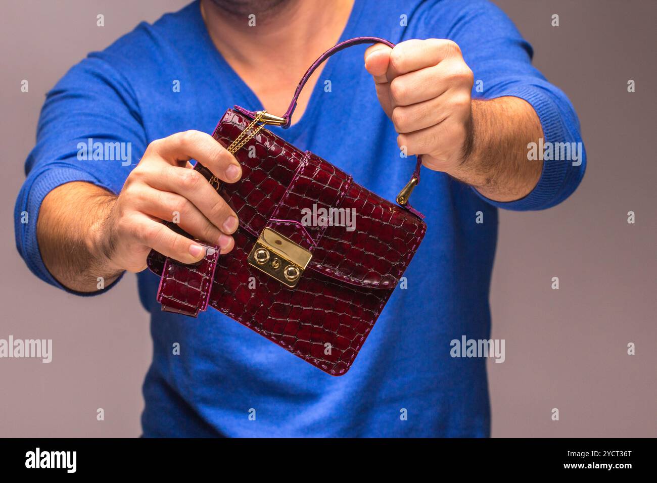 Modern leather bag in hands Stock Photo - Alamy