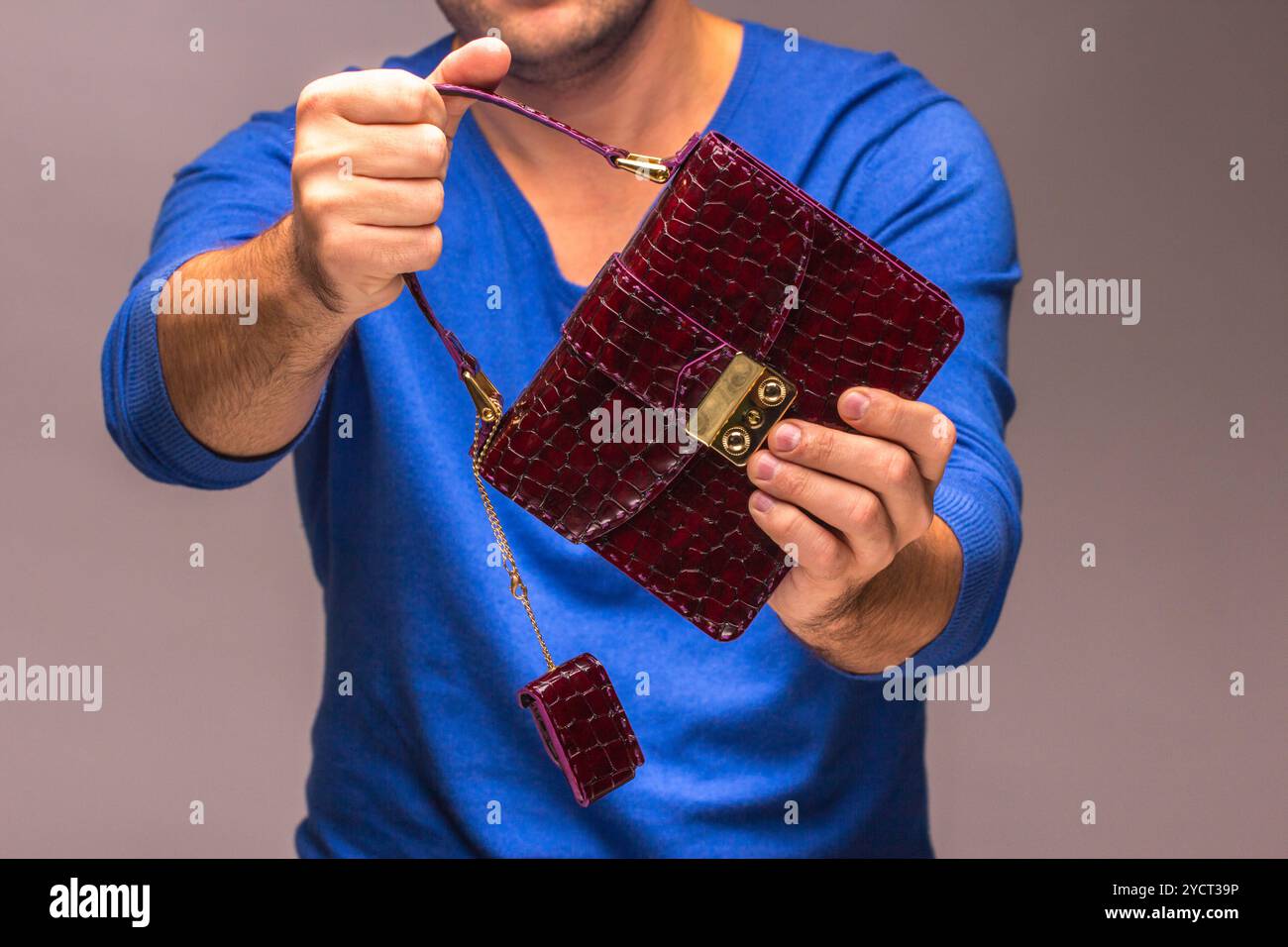 Modern leather bag in hands Stock Photo - Alamy