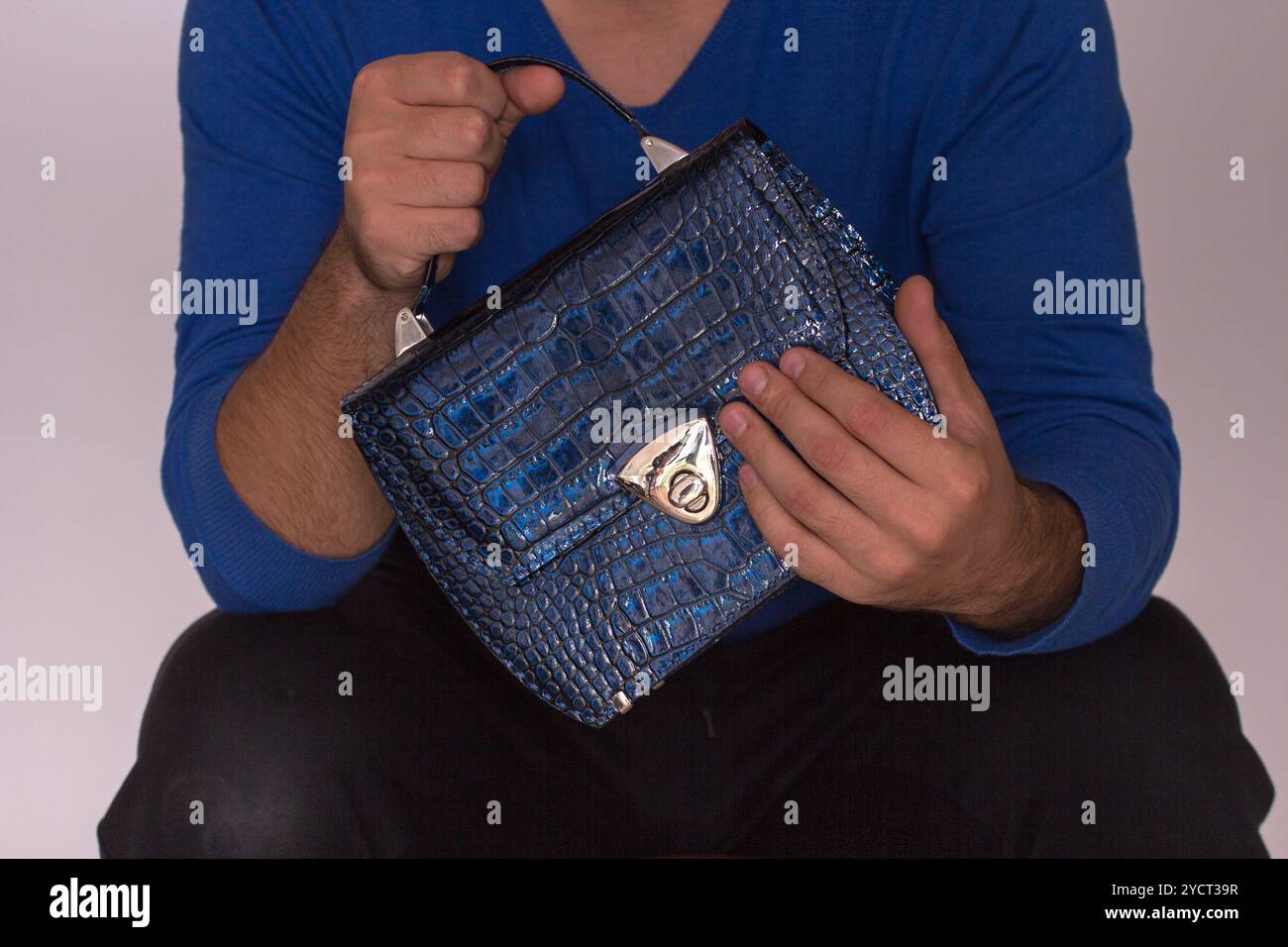 Modern leather bag in hands Stock Photo - Alamy