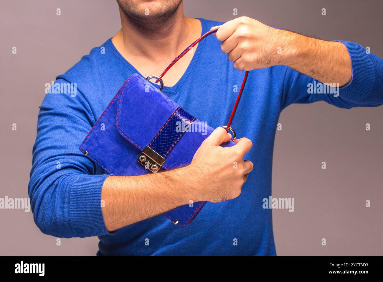 Modern leather bag in hands Stock Photo - Alamy