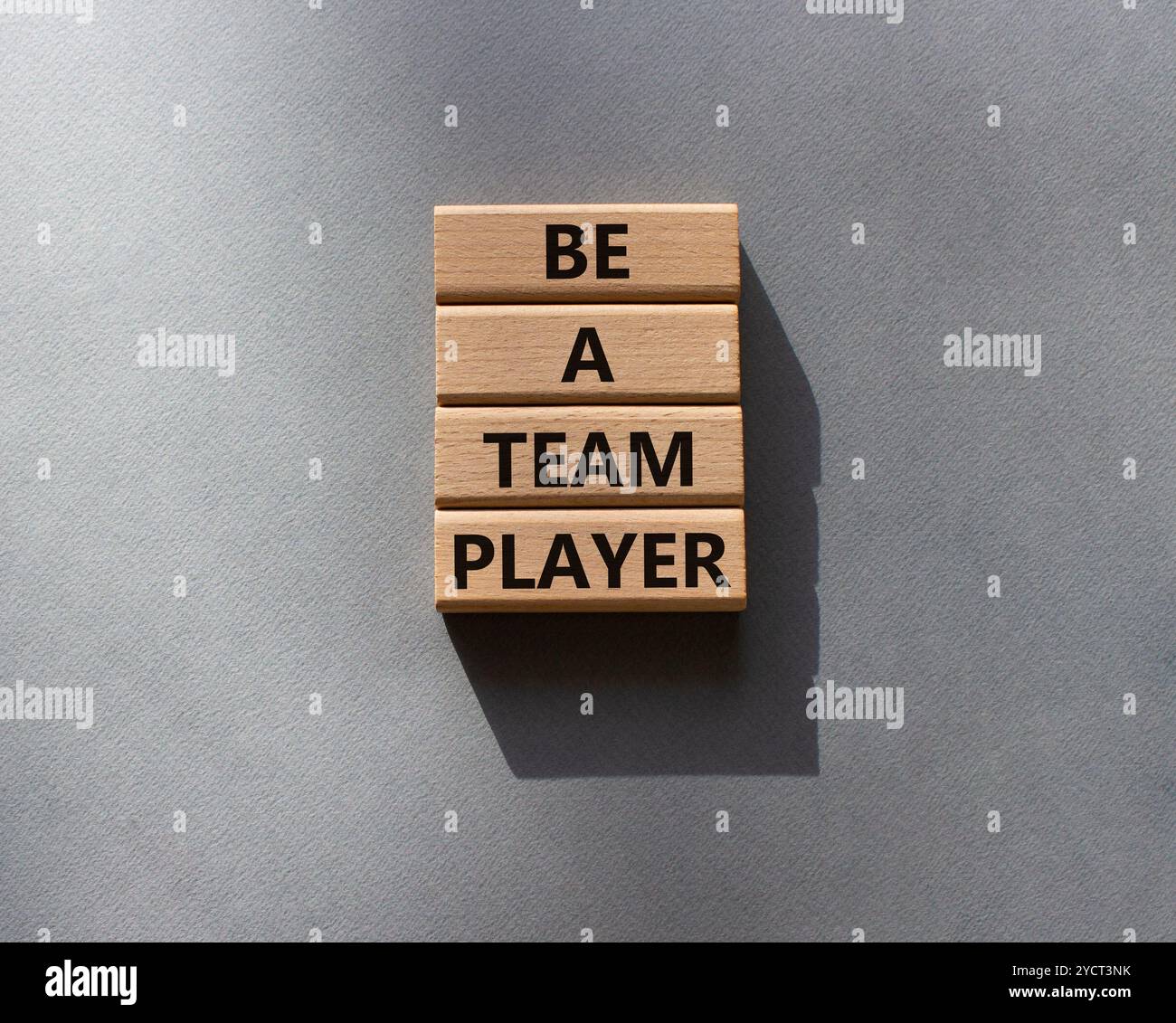 Be a team player symbol. Concept words Be a team player on wooden ...