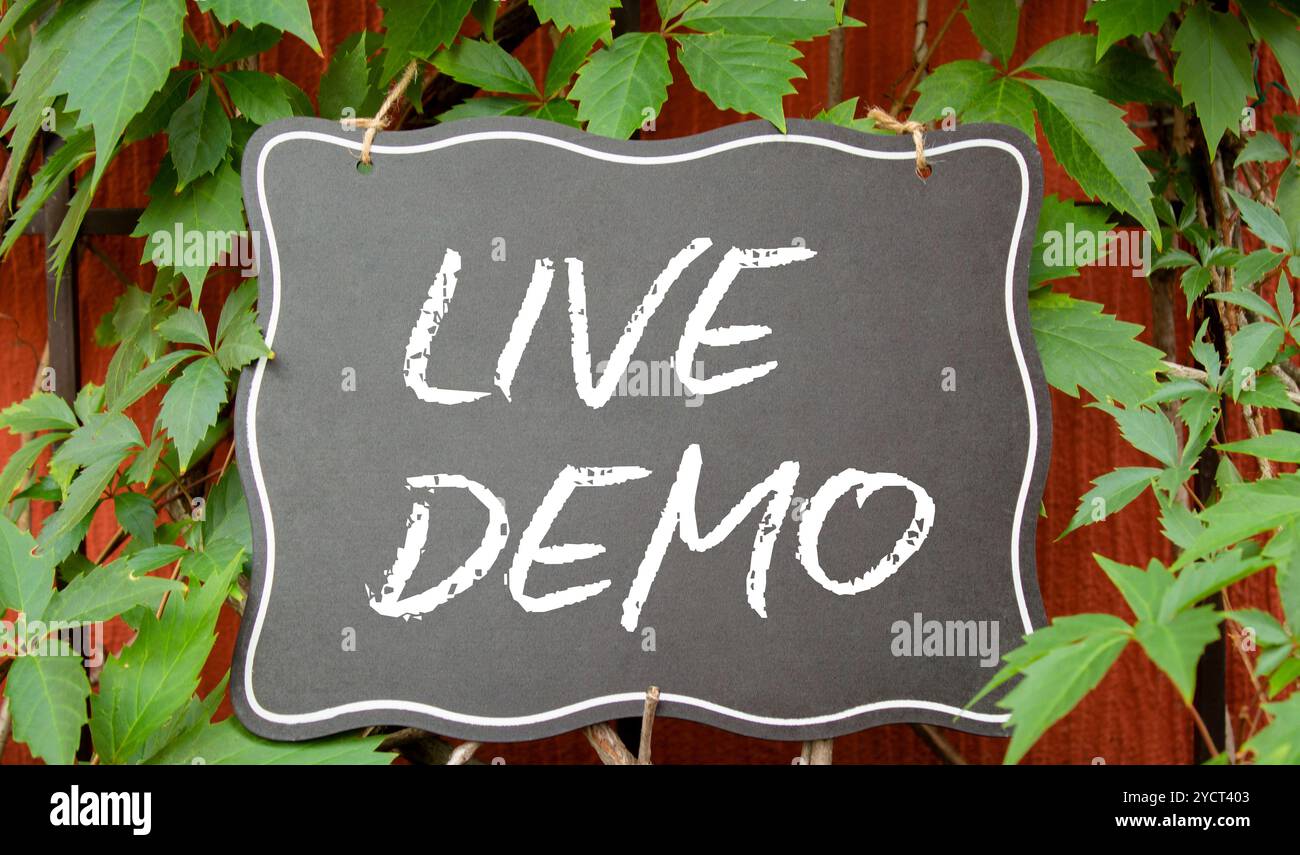 Live Demo symbol. Concept words Live Demo on black chalk background ...
