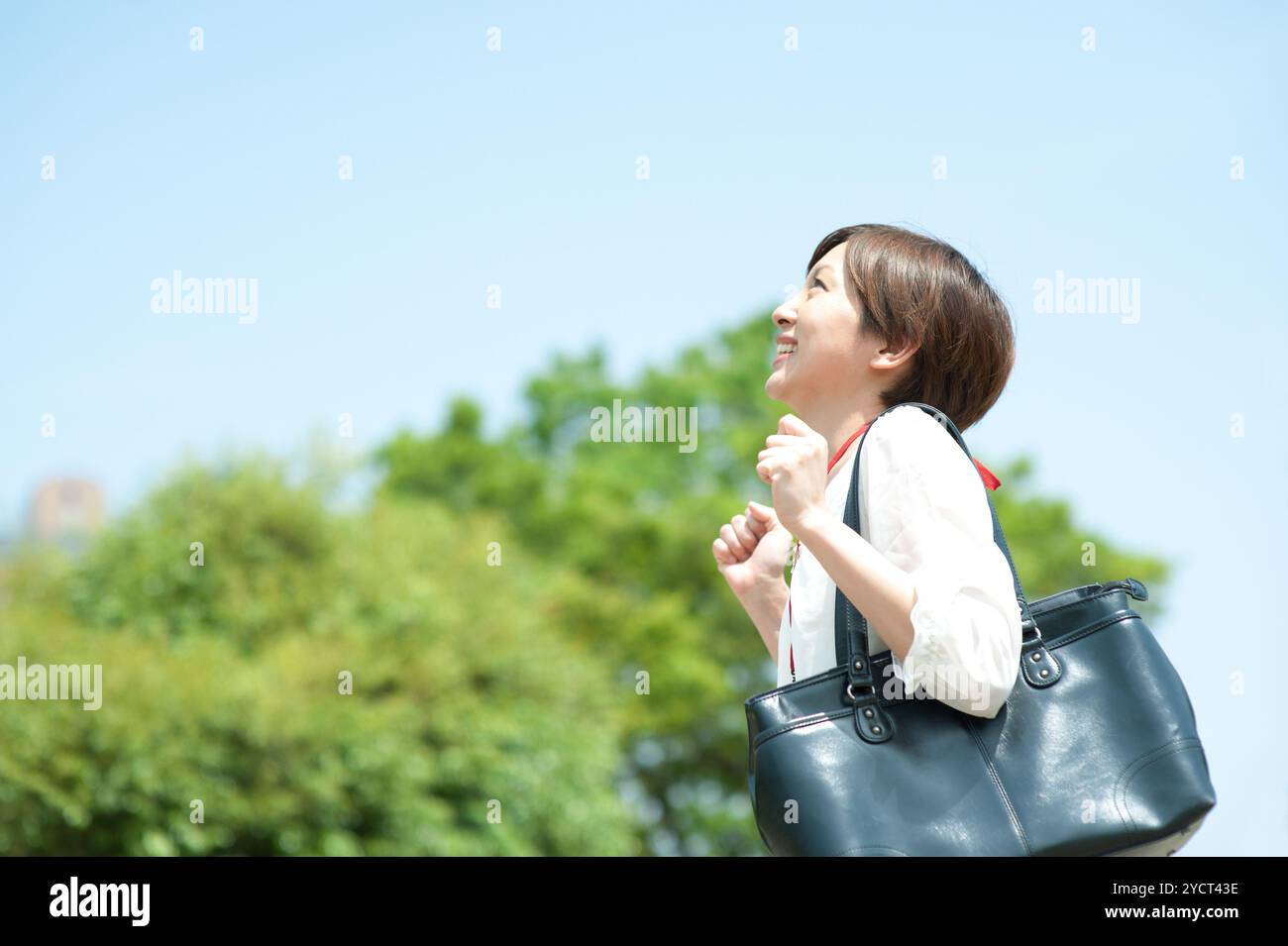 Office worker looking up at the sky Stock Photo - Alamy