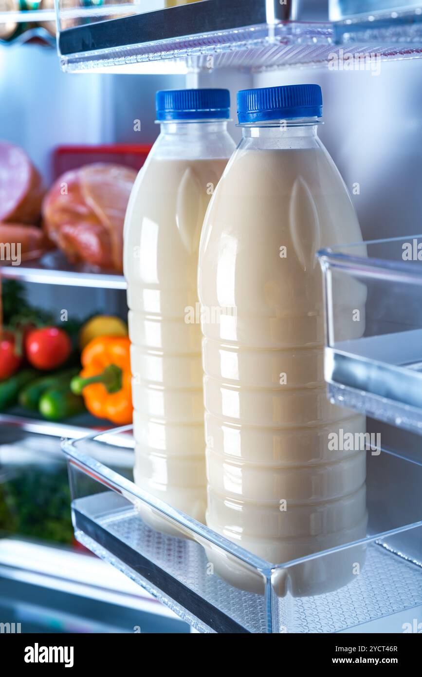 Bottles of milk in the fridge Stock Photo - Alamy