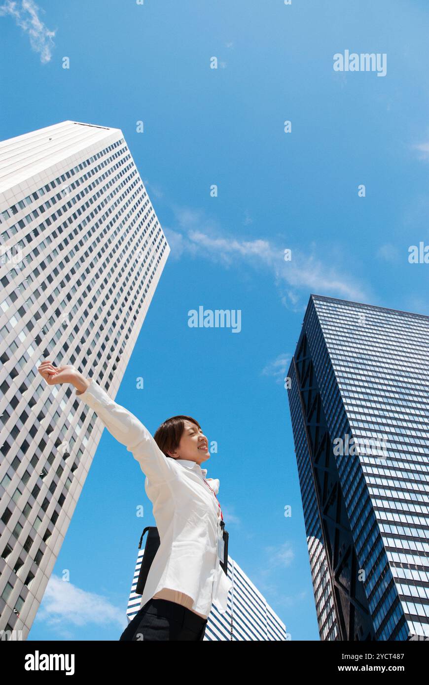 Office worker stretching in a building block Stock Photo - Alamy
