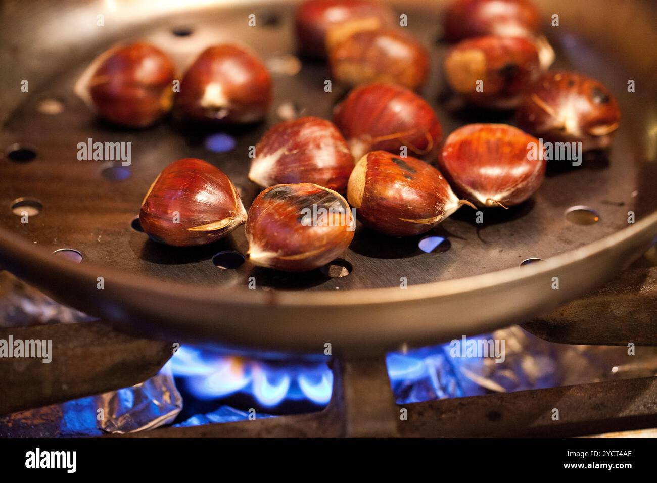 Roasted chestnuts on iron roasting hi-res stock photography and images ...