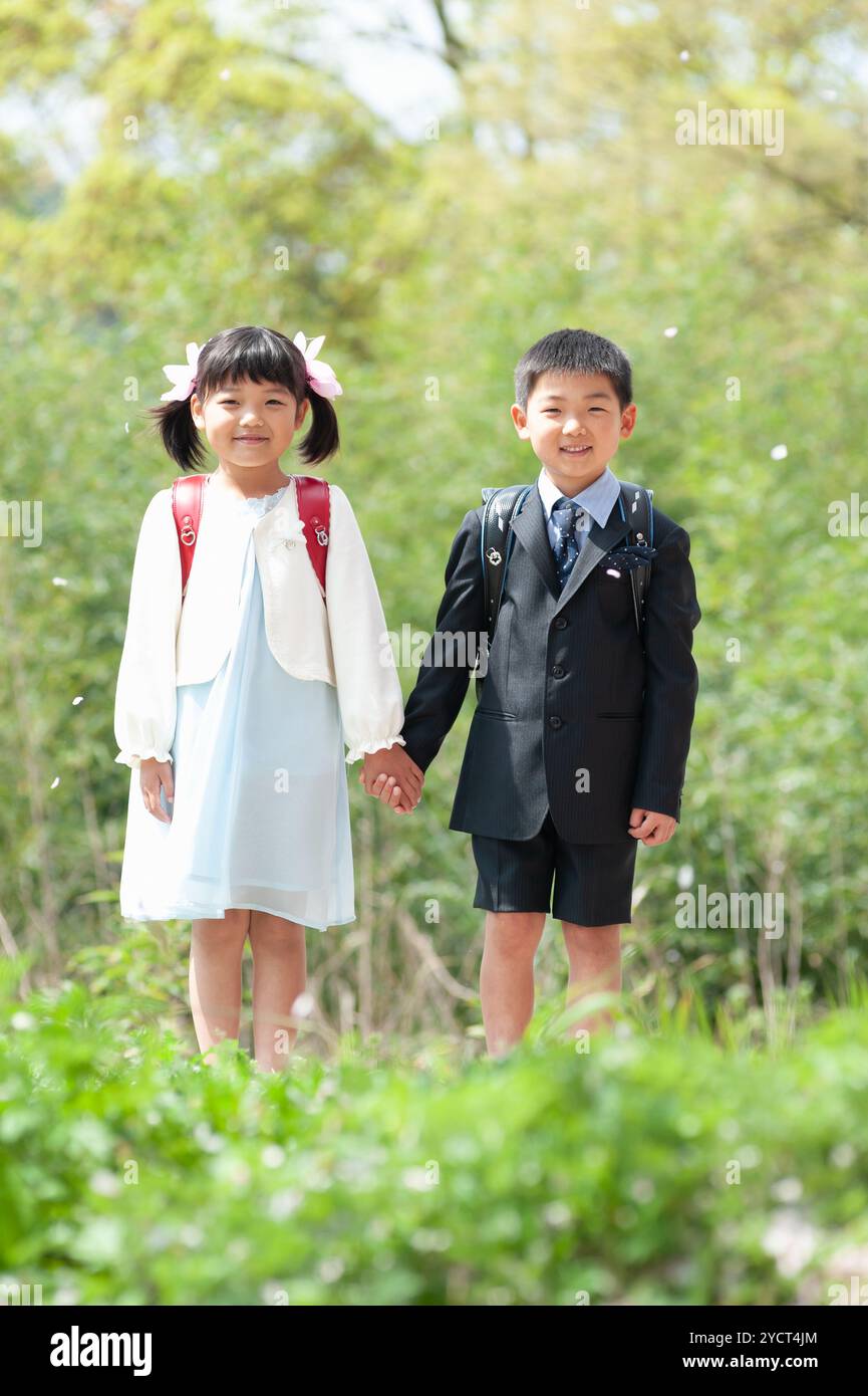 Two new first-year students standing side by side in formal dress Stock ...