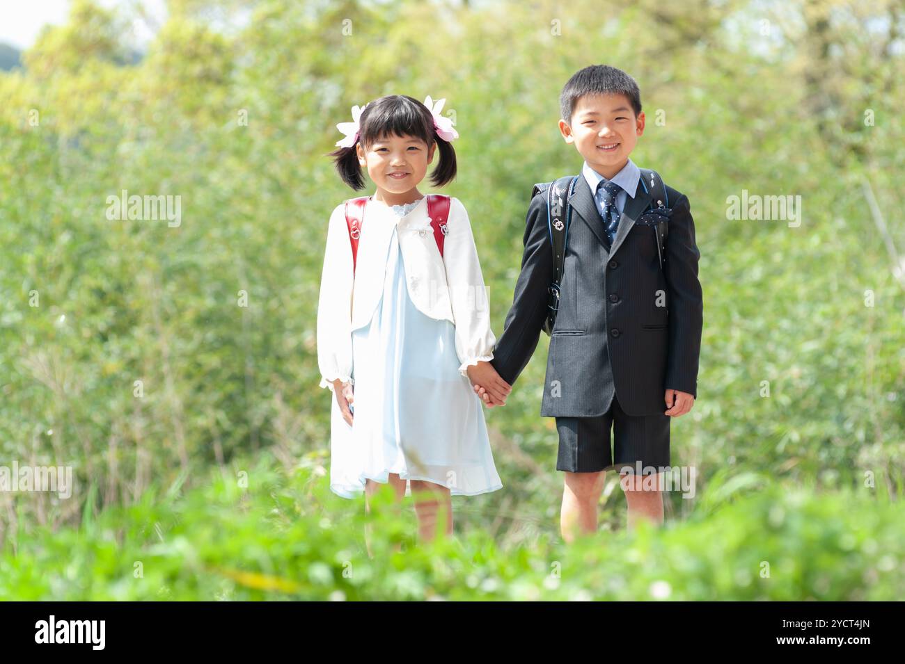 Two new first-year students standing side by side in formal dress Stock ...