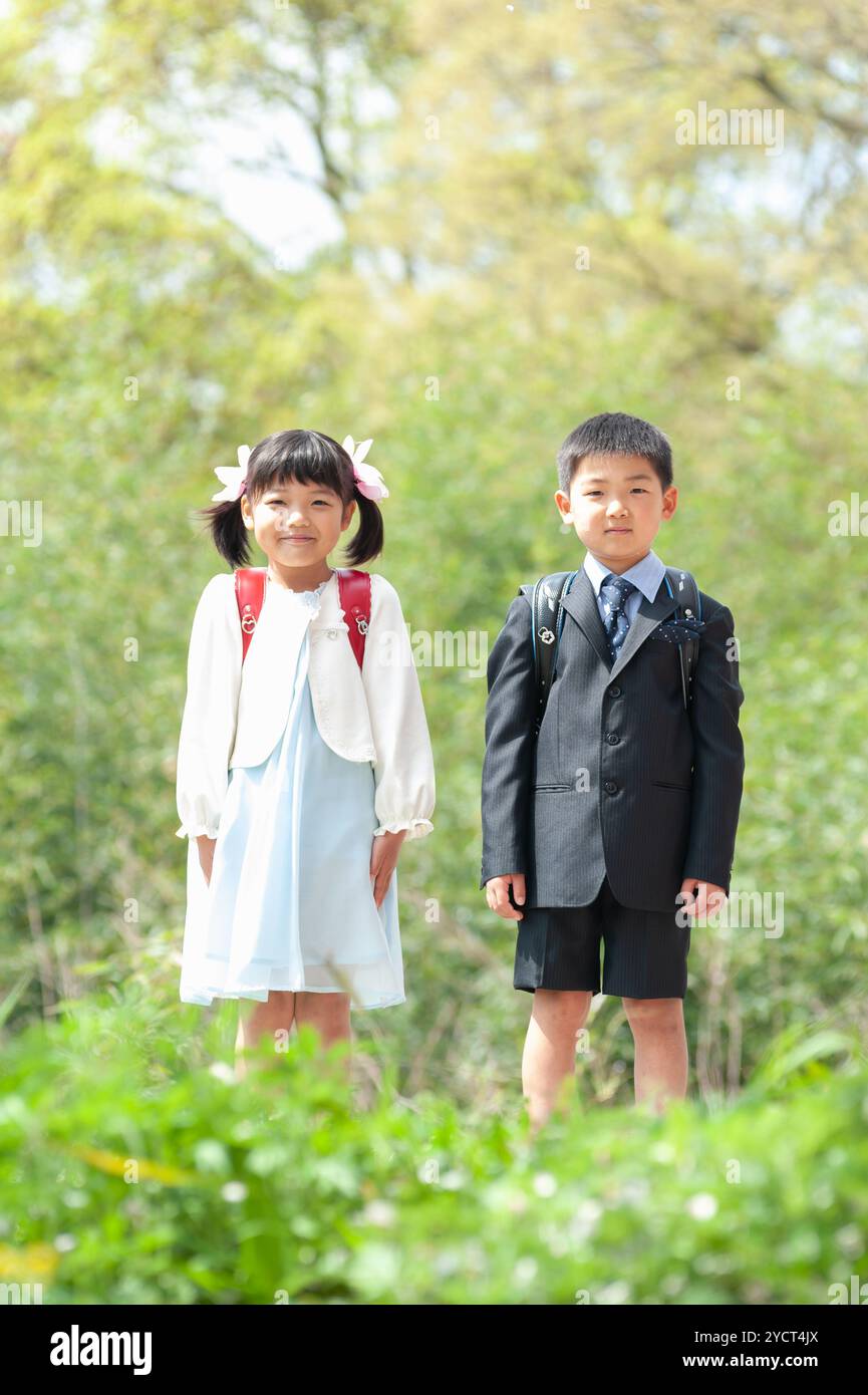 Two new first-year students standing side by side in formal dress Stock ...