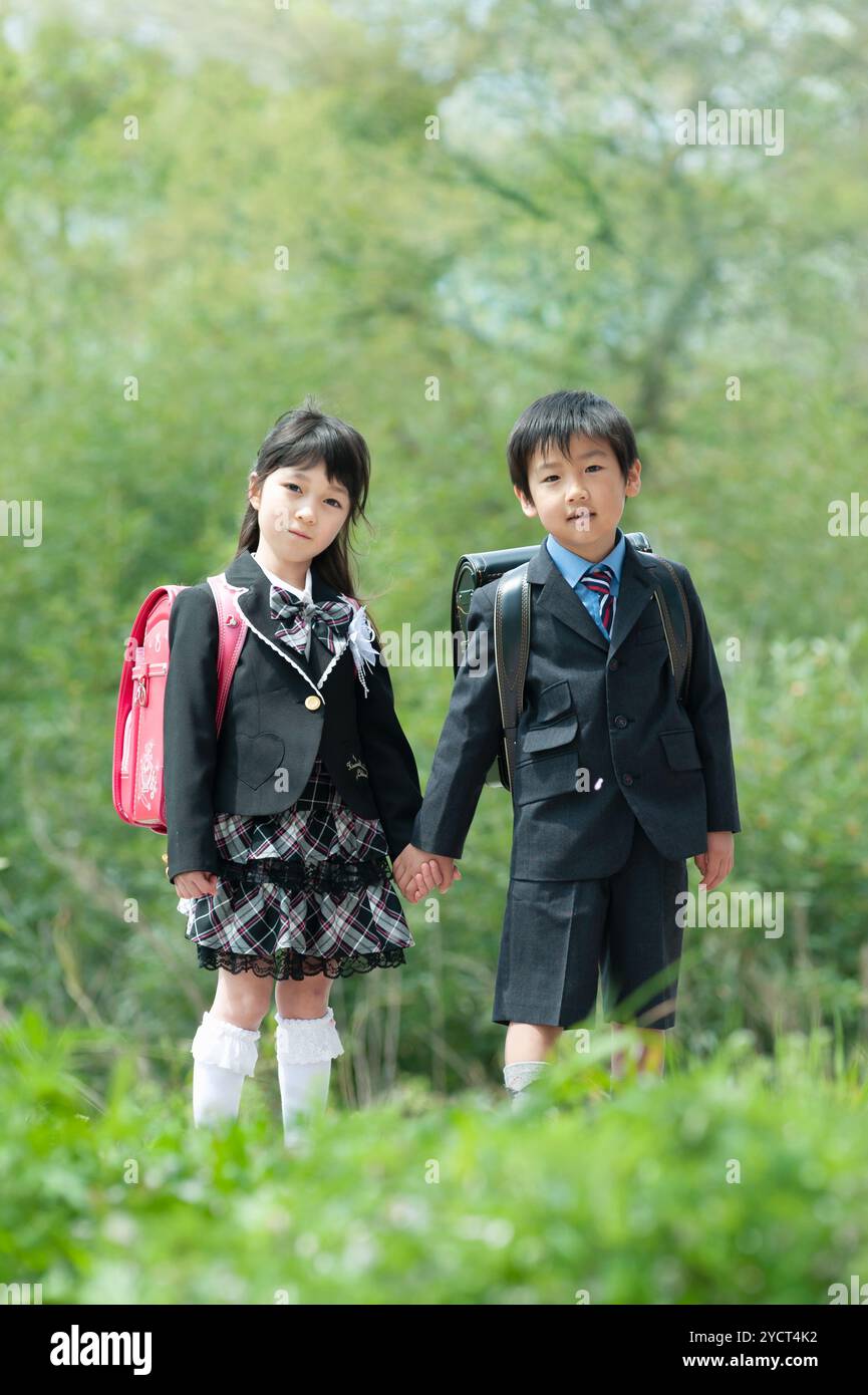 Two new first-year students standing side by side in formal dress Stock ... Two new first-year students standing side by side in formal dress Stock ...
