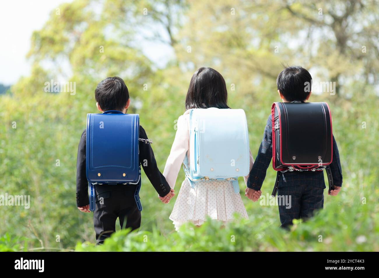 Three new first-year students walking side by side Stock Photo - Alamy