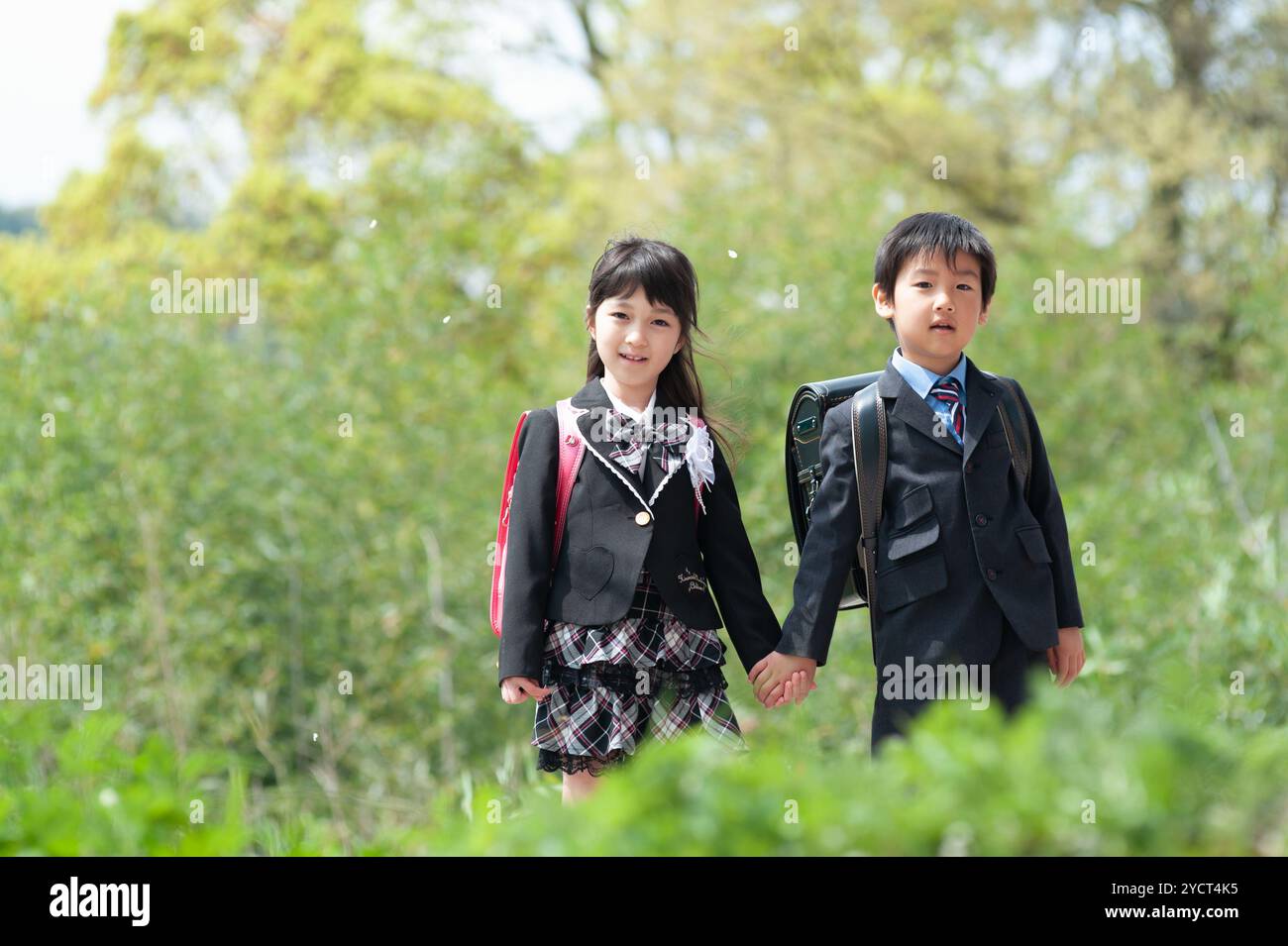 Two new first-year students standing side by side in formal dress Stock ...